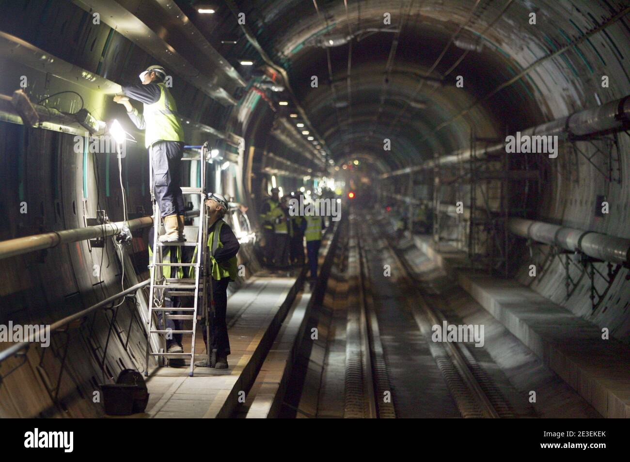 Workers repair damages in the part of the Channel Tunnel known as ...