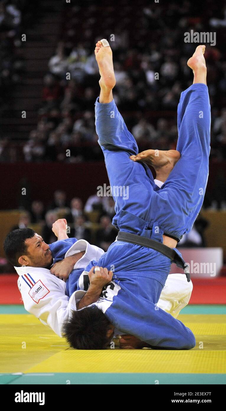 Japan's Takashi Ono (blue) battles with France's Yves Matthieu ...