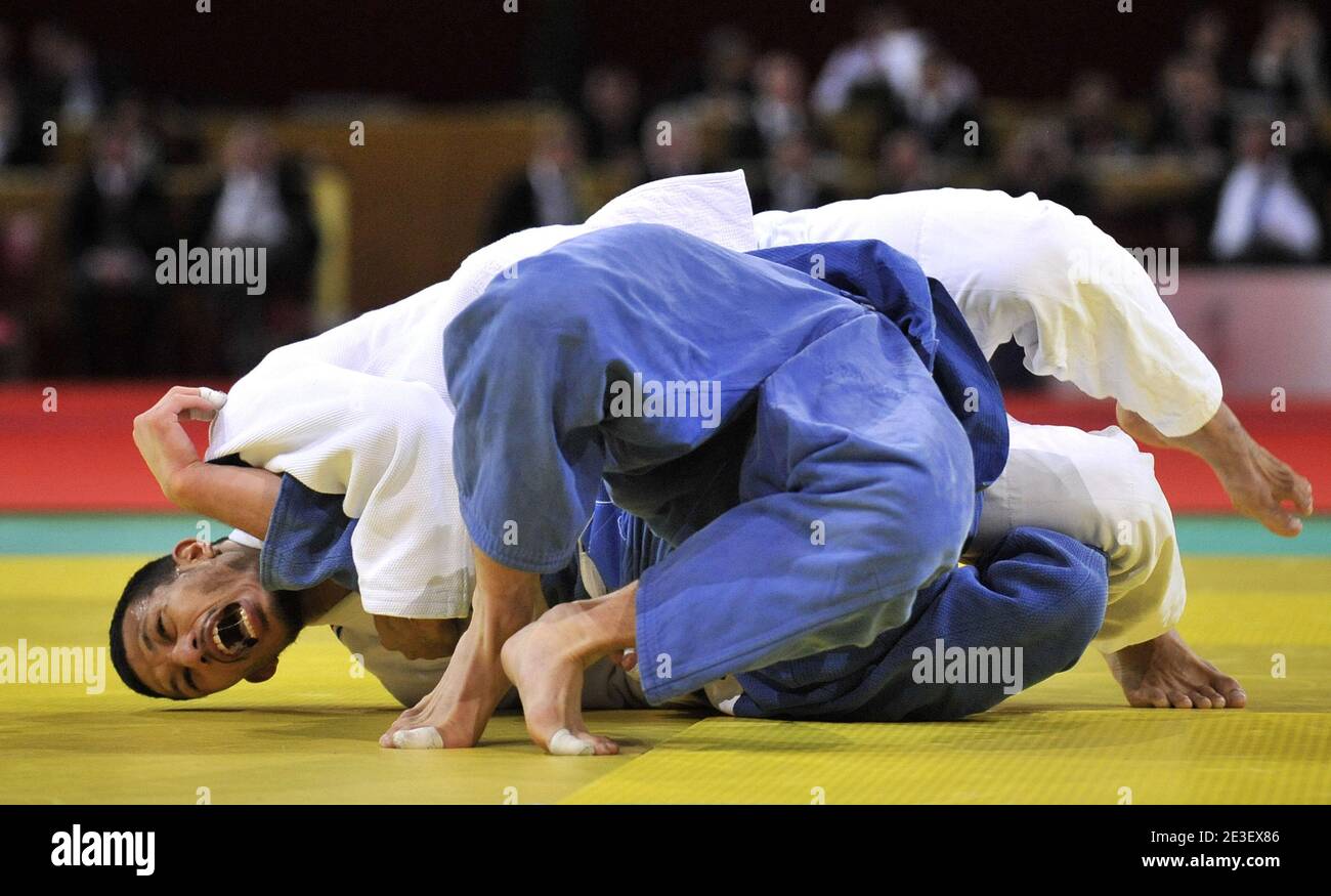 Japan's Takashi Ono (blue) battles with France's Yves Matthieu ...