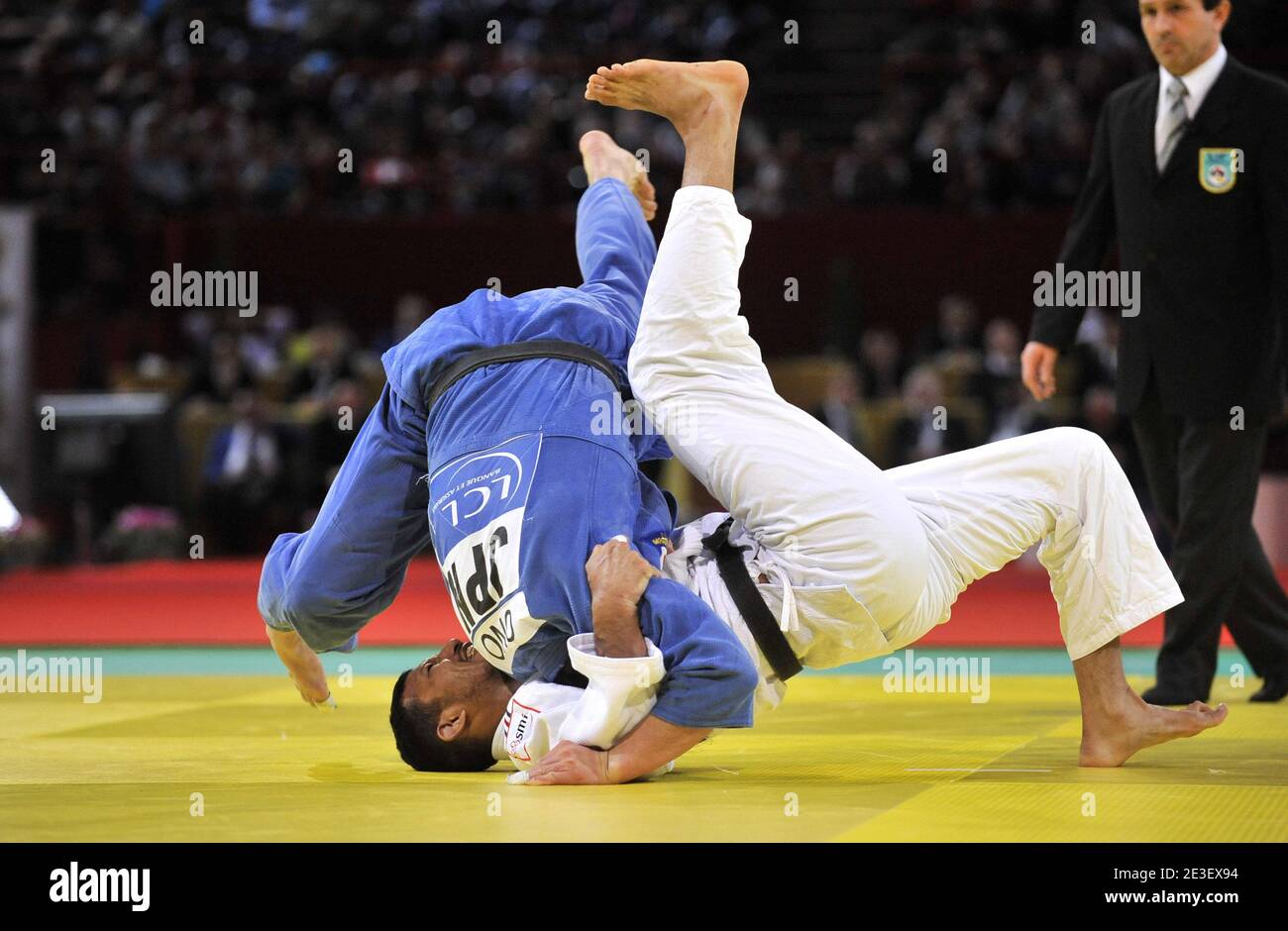 Japan's Takashi Ono (blue) battles with France's Yves Matthieu ...