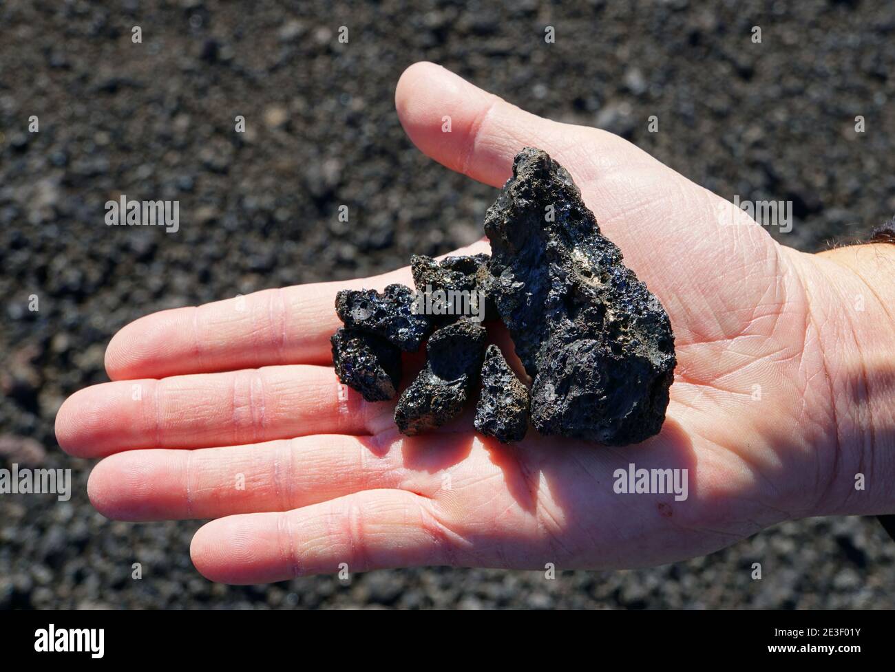 Holding the igneous rock formed from the volcanic eruption at Krafla ...