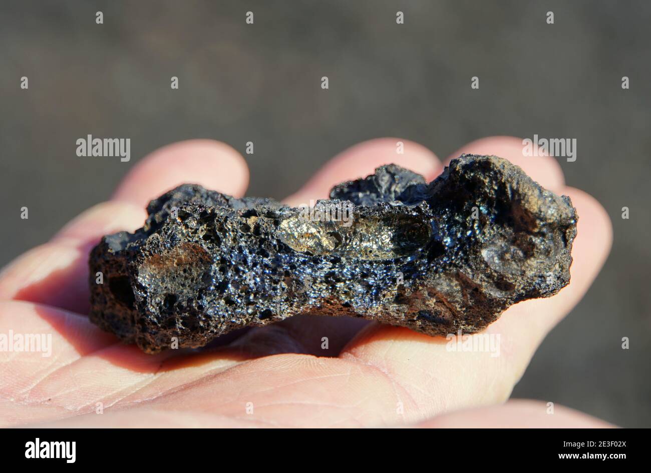 Holding the igneous rock formed from the volcanic eruption at Krafla ...