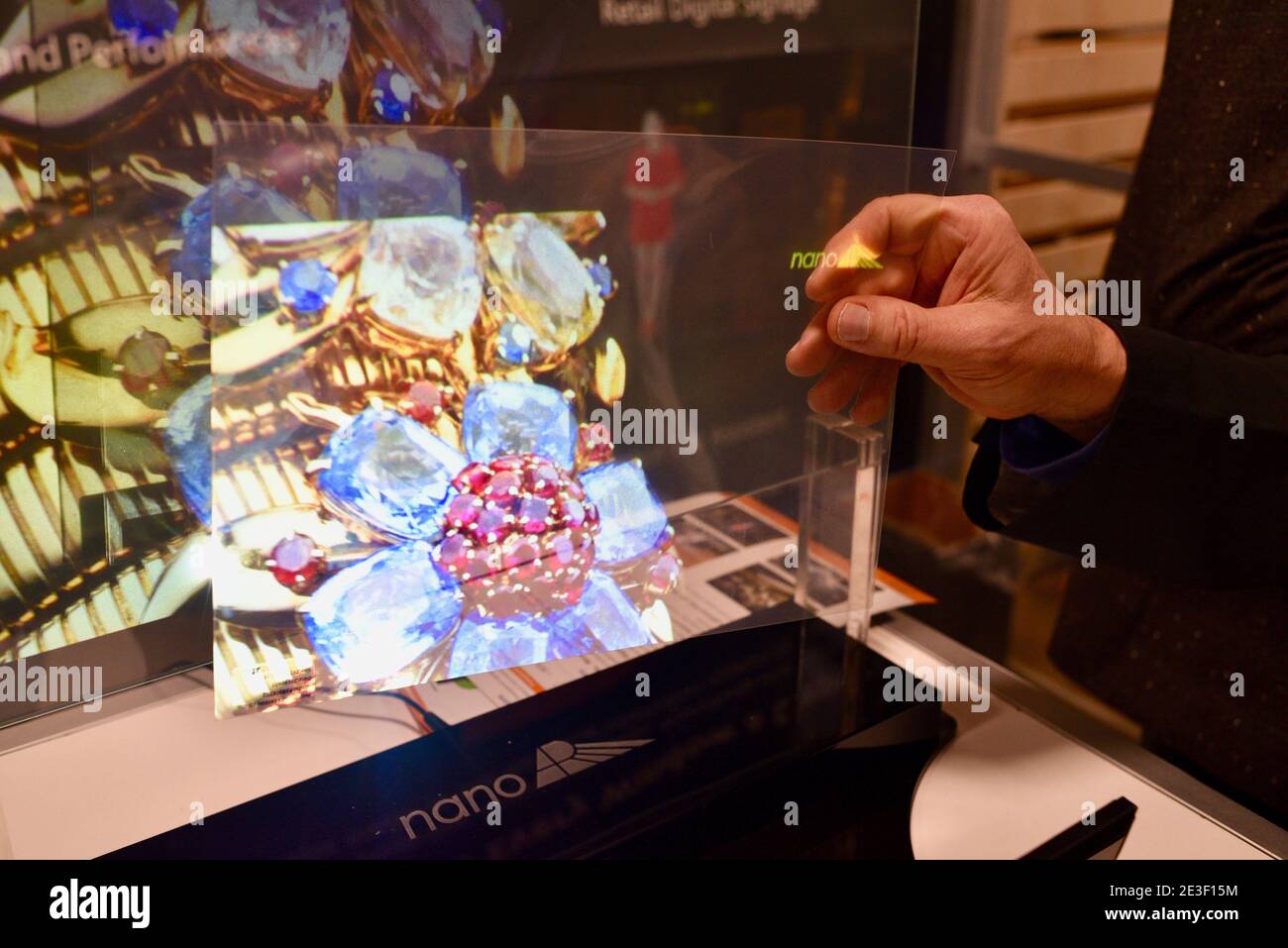 Hand holding transparent 360-degree holographic with image display ...