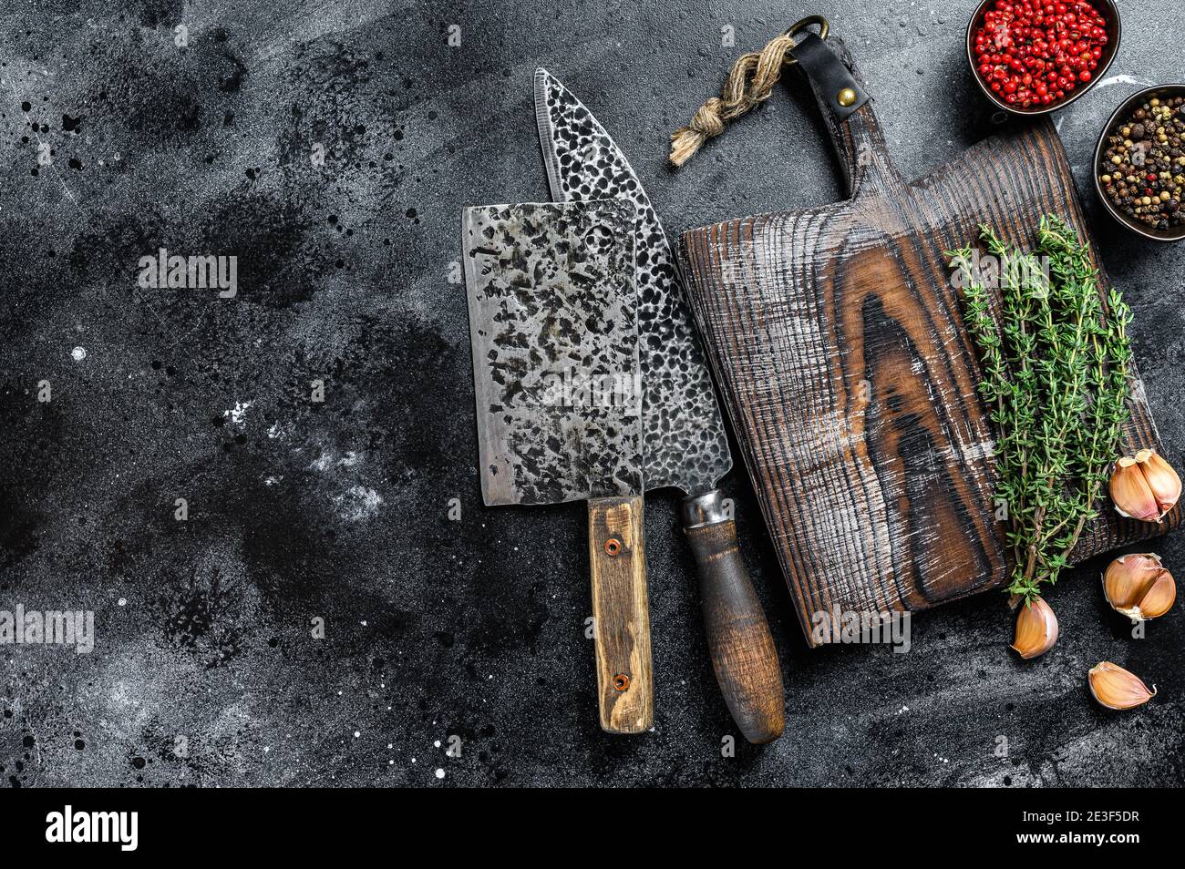 Old Used Meat Cleaver and knife with wooden cutting board. Black ...