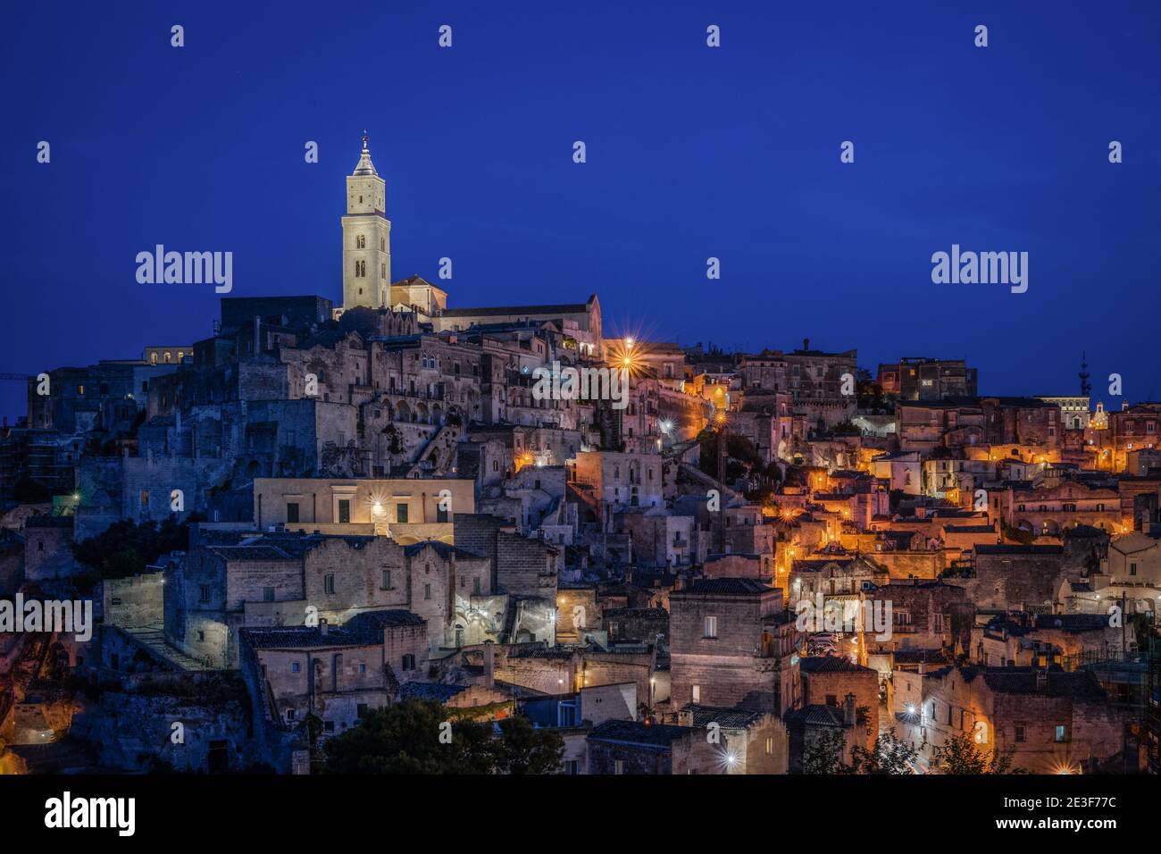 Scenic night view at blue hour of Matera with the illuminated bell ...