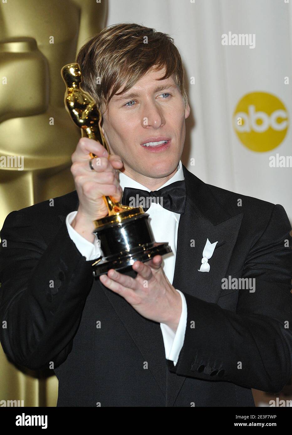 Dustin Lance Black with his award for Original Screenplay in the press ...