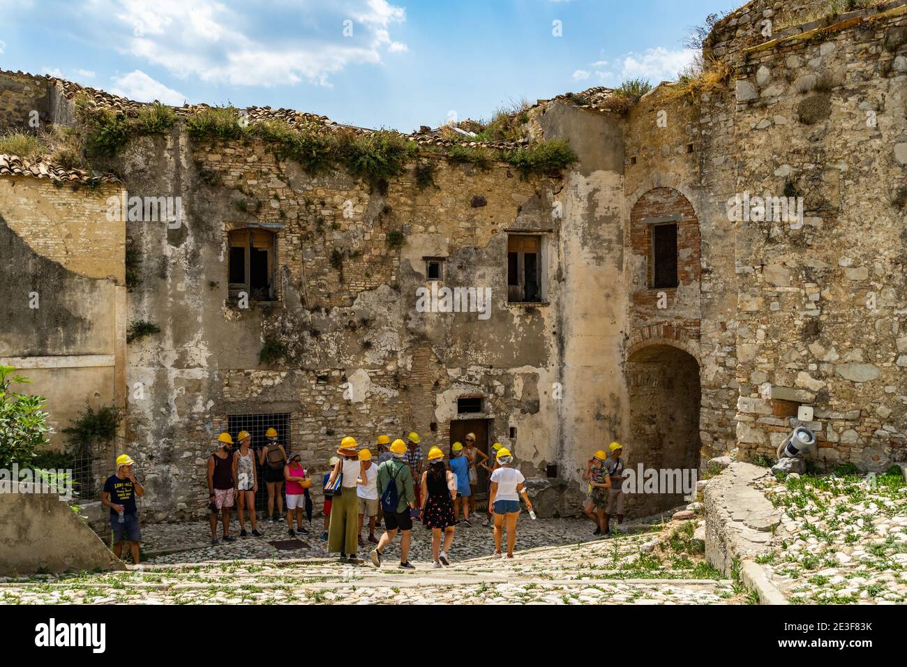 Craco, Basilicata, Italy, August 2020 - Tourists in a guided tour ...