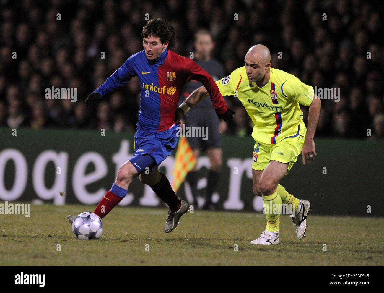 Barcelona's Lionel Messi battles Lyon's Cris during the UEFA Champions ...
