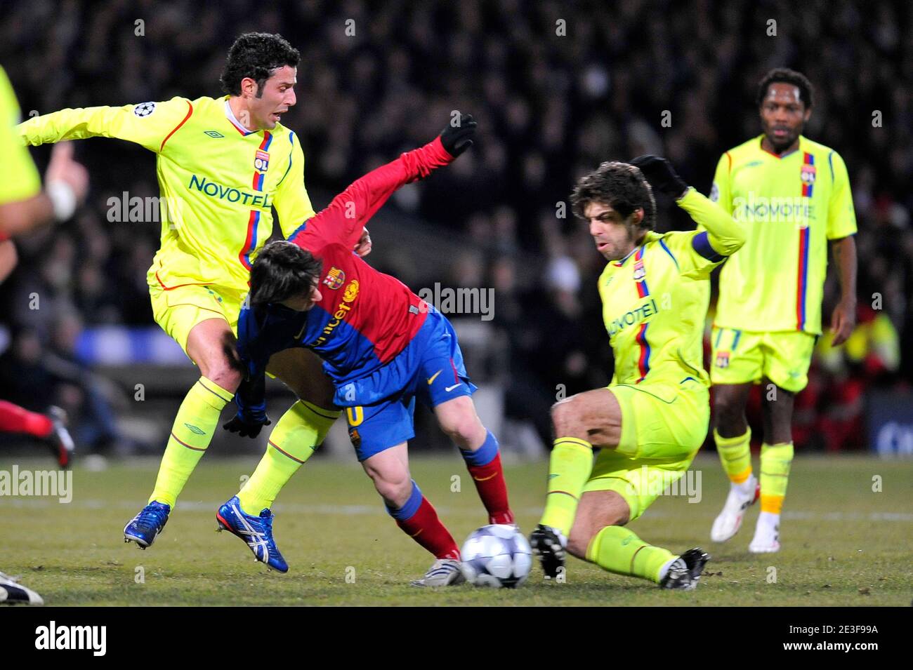 Barcelona's Lionel Messi challenges Lyon's Juninho during the UEFA ...