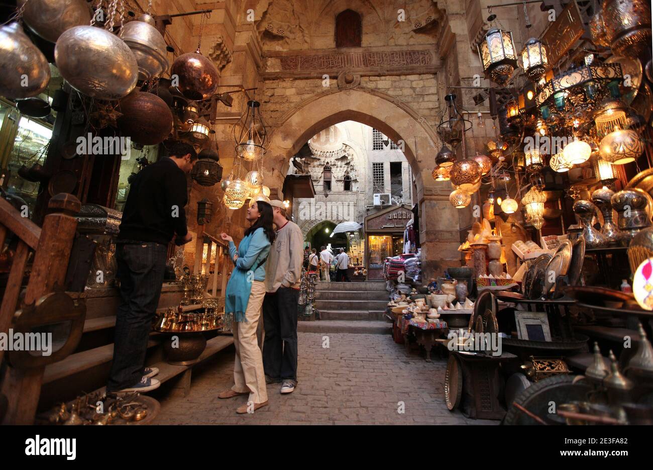 Tourists look at copper wares in Khan El Khalili market near the site ...