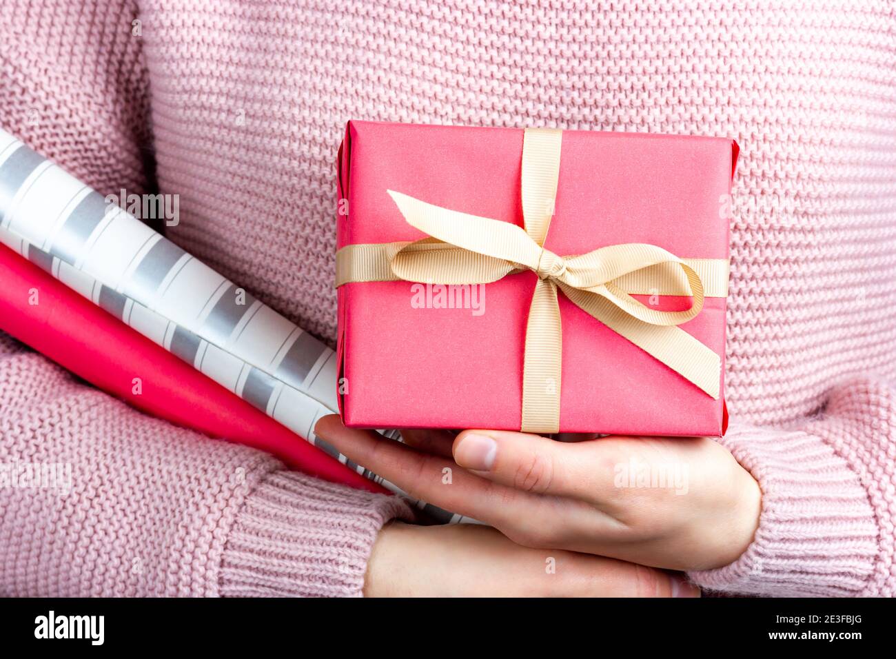 Female hands with wrapping paper and gift box. Gift wrapping process ...