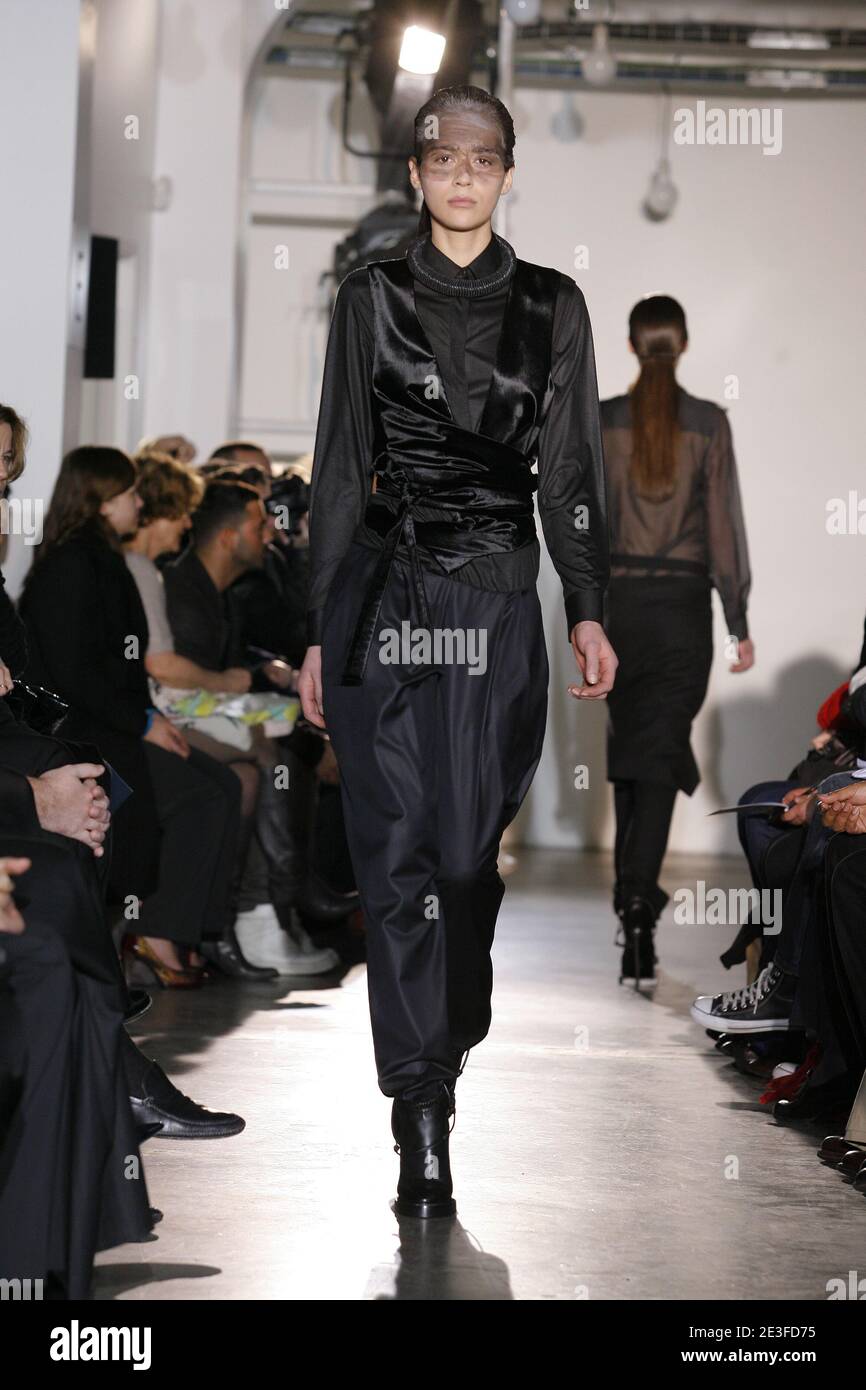 A model displays a creation by Belgian designer Kris Van Assche for his ...