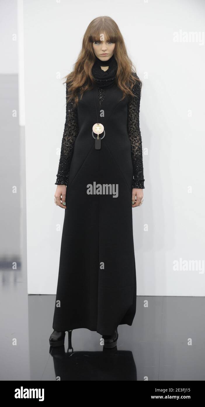 A model displays a creation by designer Karl Lagerfeld for Chanel Fall ...