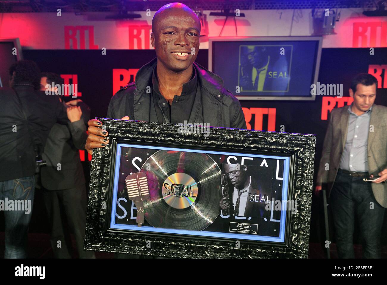 British singer/songwriter Seal poses with a diamond record for his ...
