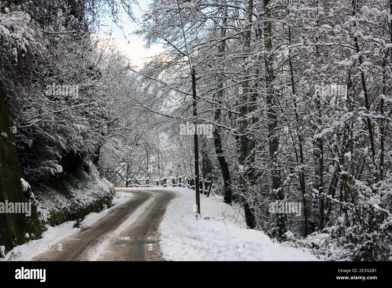 Bumpy and poorly paved road trail on mountain winter snow white dirt ...