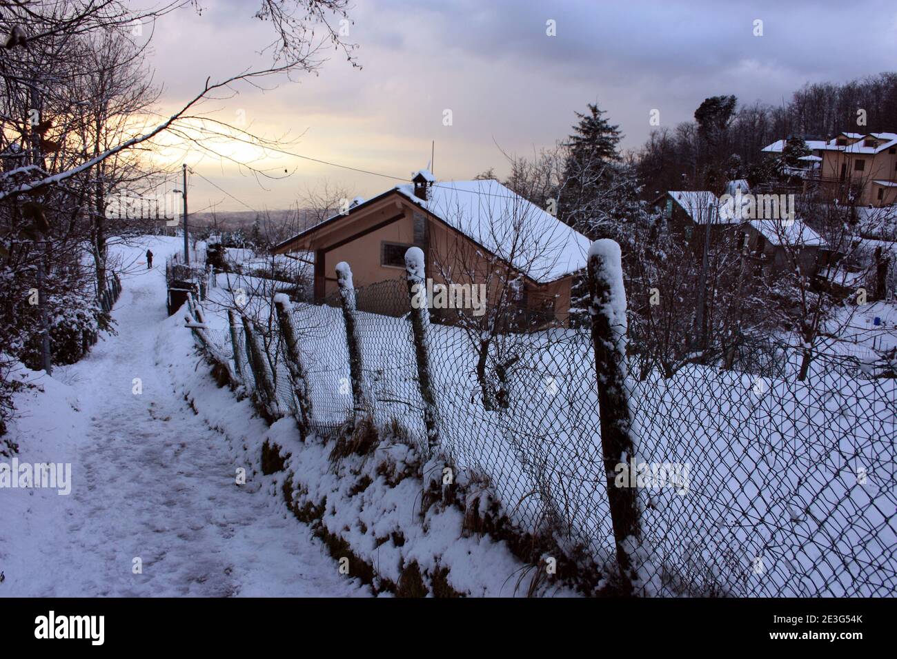 small hut or chalet in the mountains in the soft white snow of winter ...
