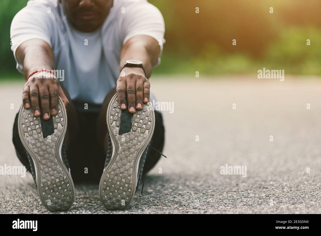 Close up Asian young athlete sport runner black man wear watch he ...