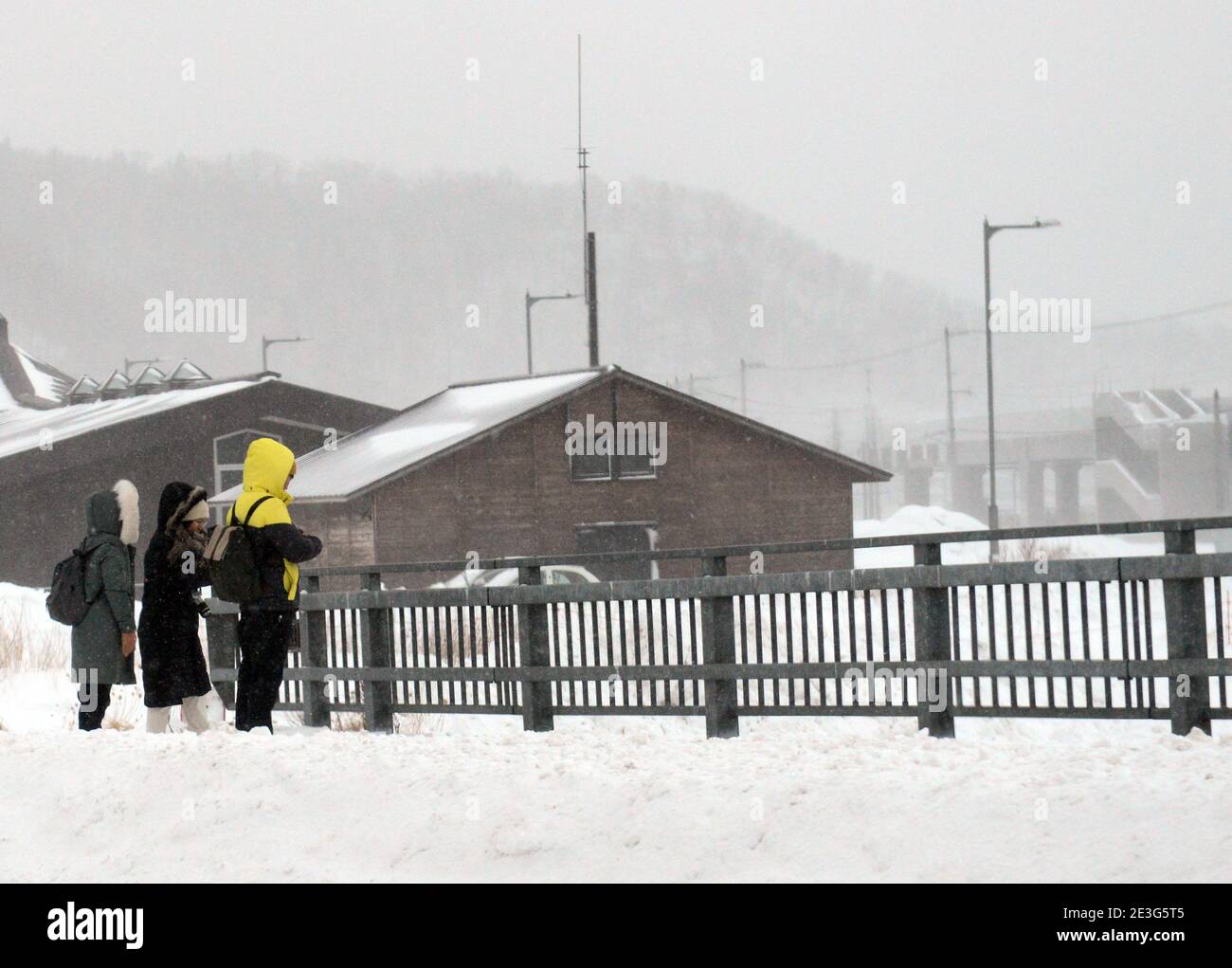 Tourist enjoying the dramatic ocean views in Utoro, Hokkaido, Japan ...