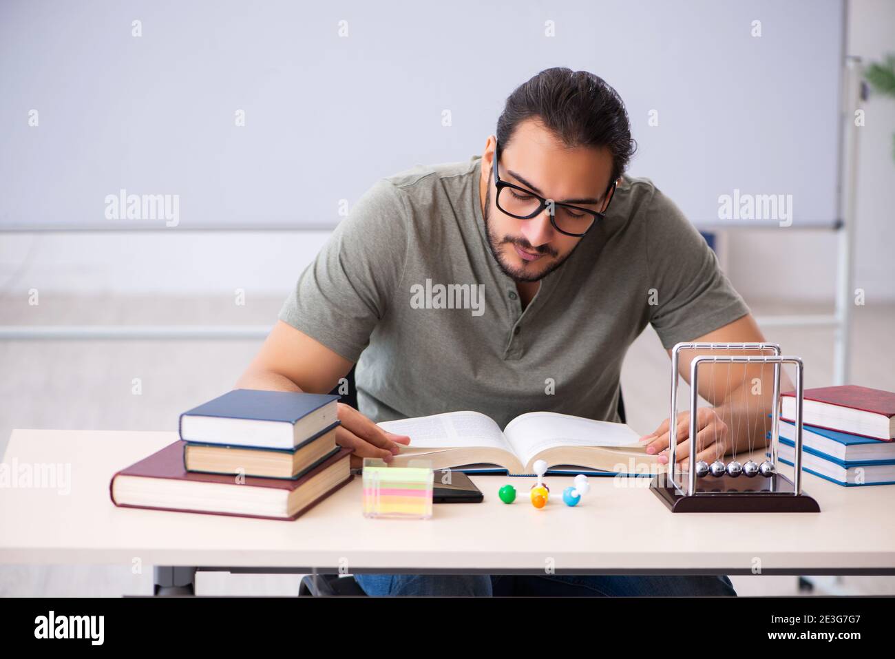 Young student preparing for exams in the classroom Stock Photo - Alamy