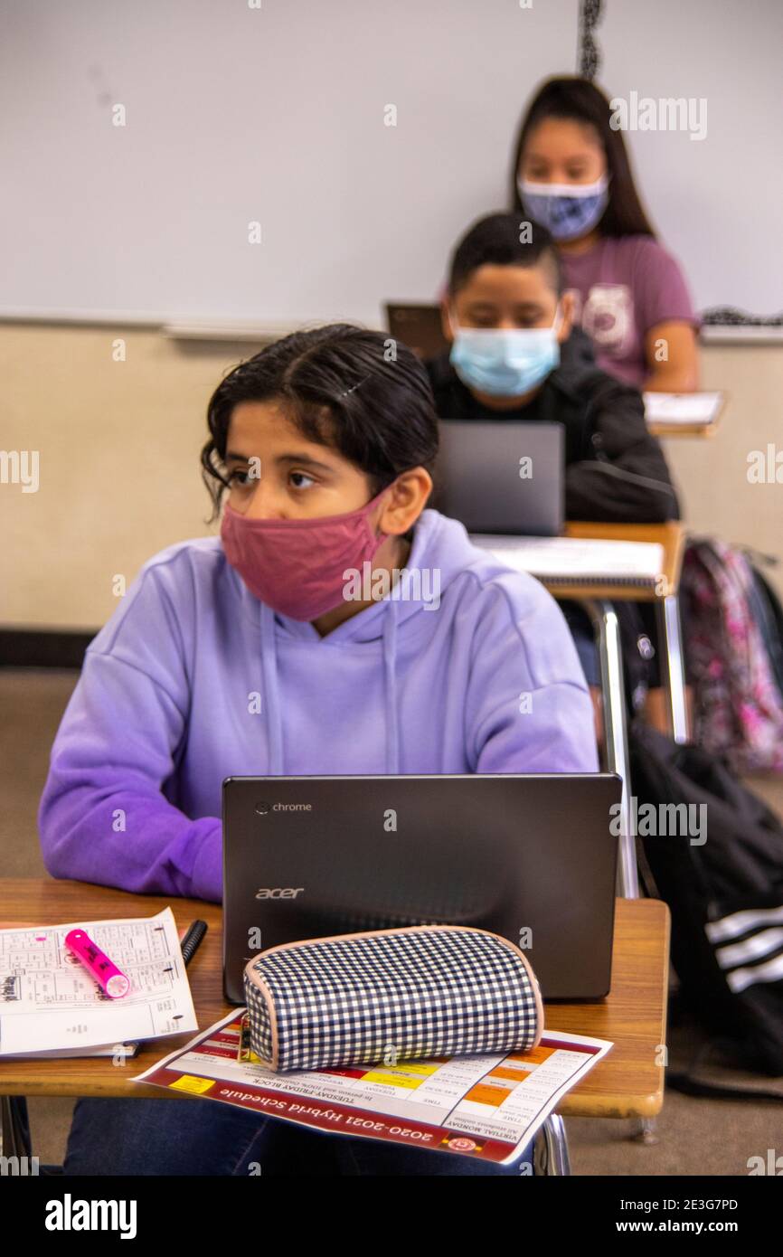 Wearing face masks due to the coronavirus pandemic, Hispanic sixth ...