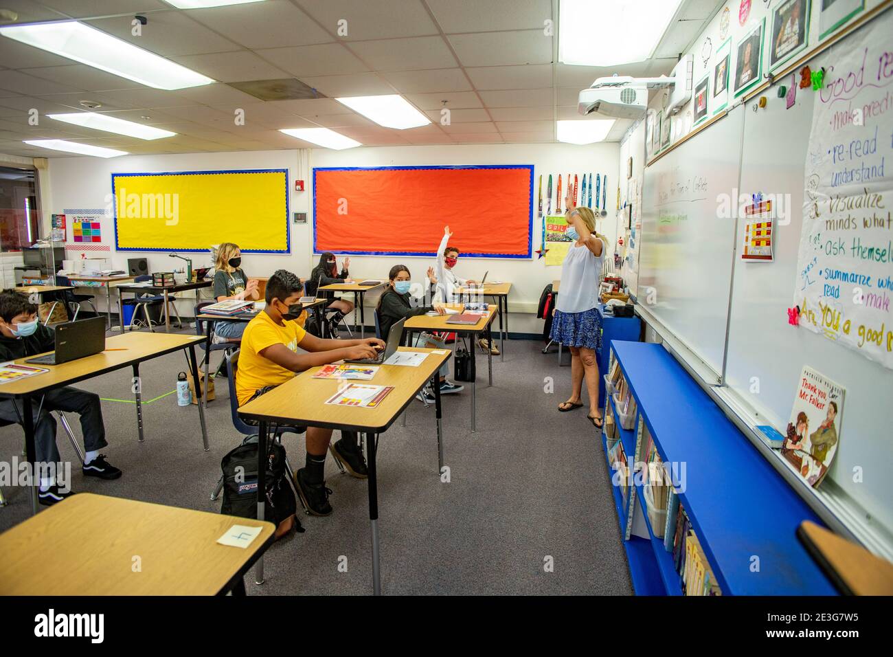 Wearing a face mask due to the coronavirus pandemic, a seventh grade ...
