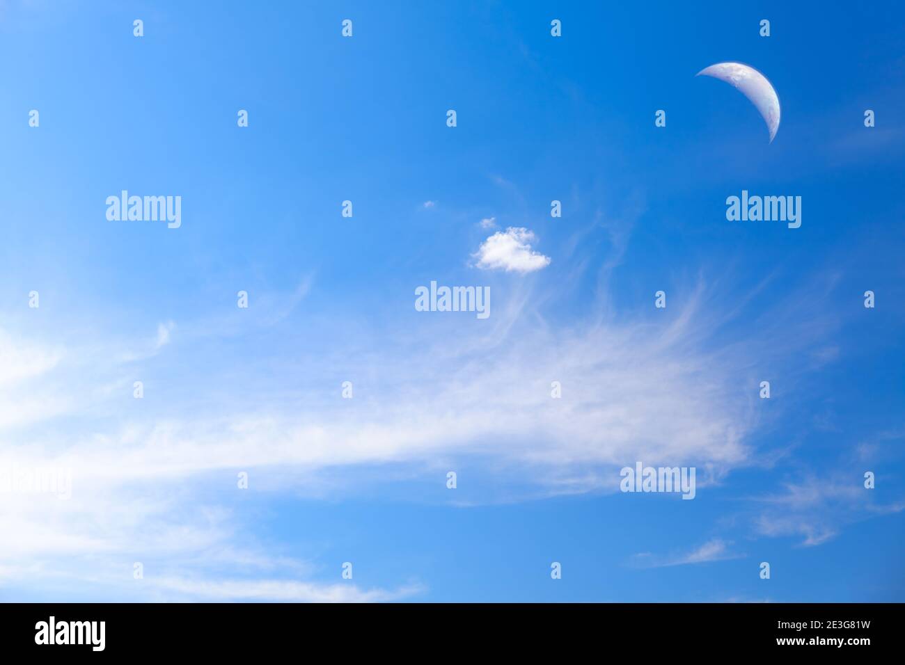Moon in daytime at blue sky Stock Photo - Alamy
