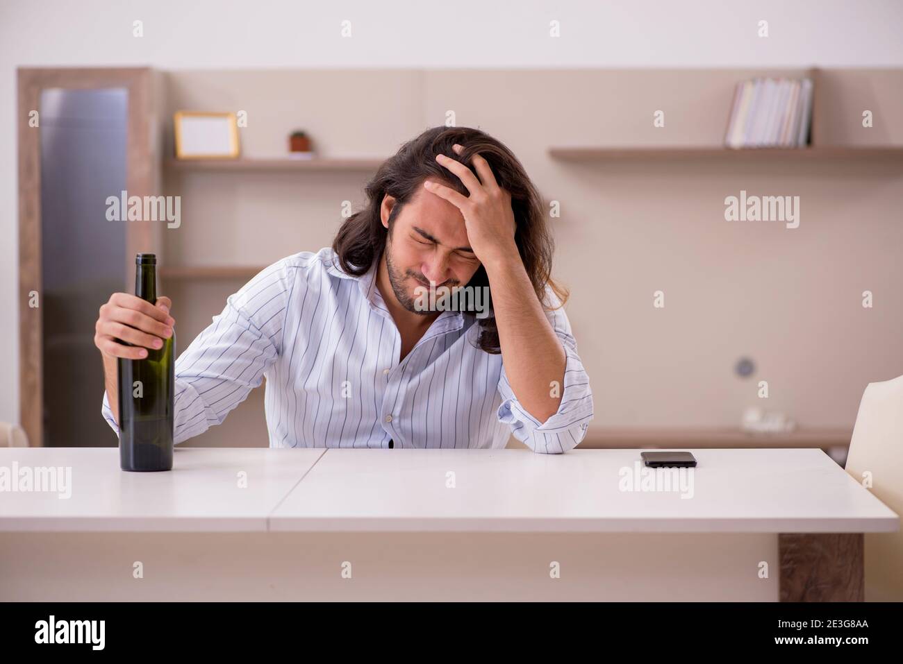 Man drinking alcohol at home Stock Photo - Alamy