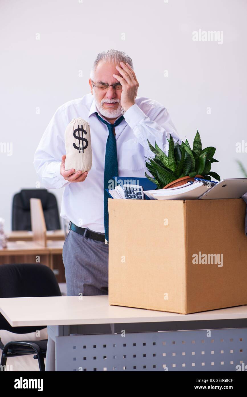 Old employee being fired from his work in retirement concept Stock ...