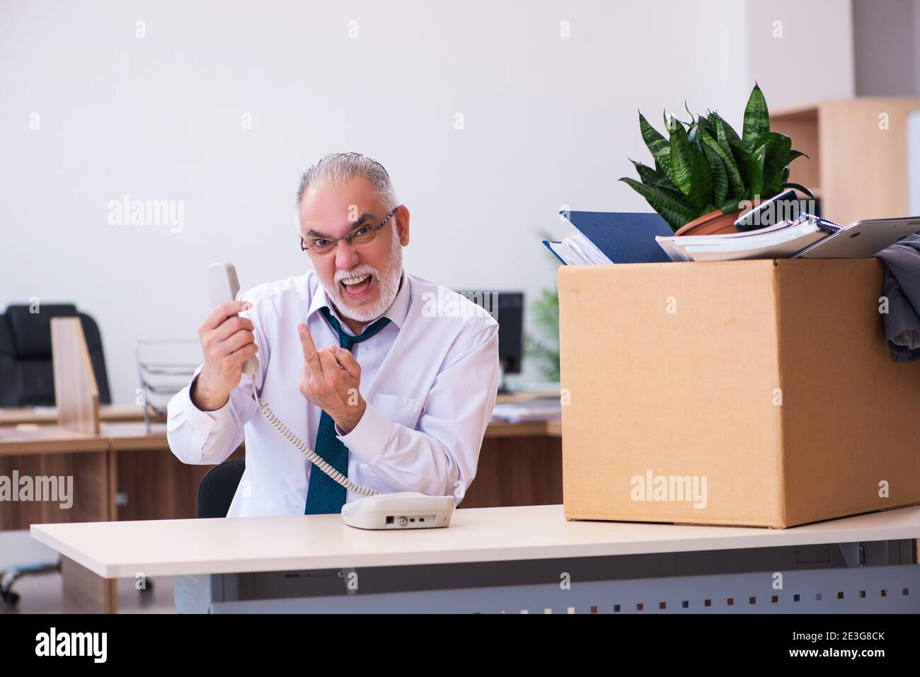 Old employee being fired from his work Stock Photo - Alamy