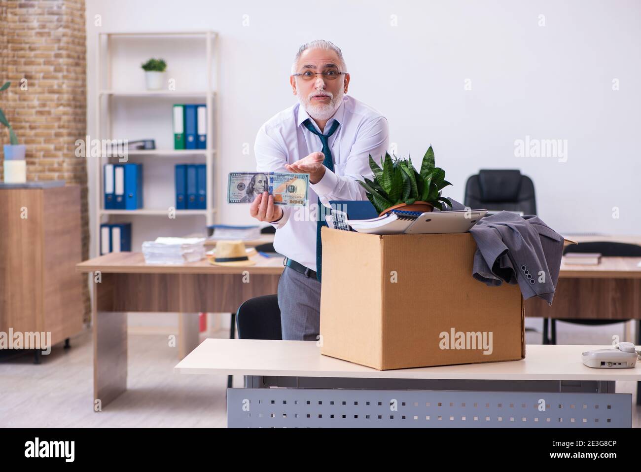 Old employee being fired from his work in retirement concept Stock ...