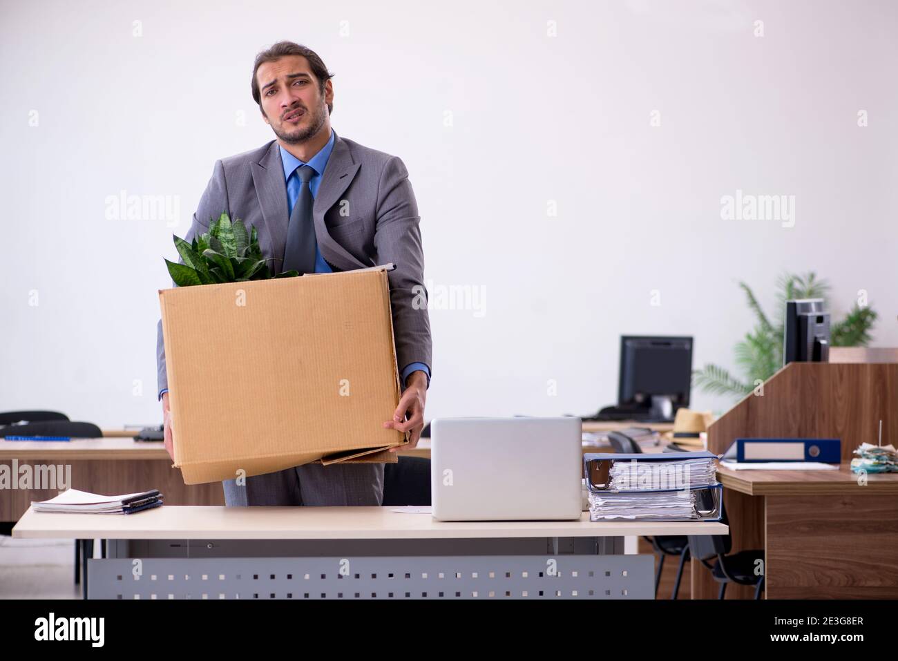 Young employee being fired from his work Stock Photo - Alamy