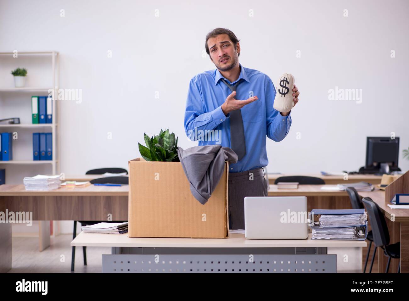 Young employee being fired from his work Stock Photo - Alamy