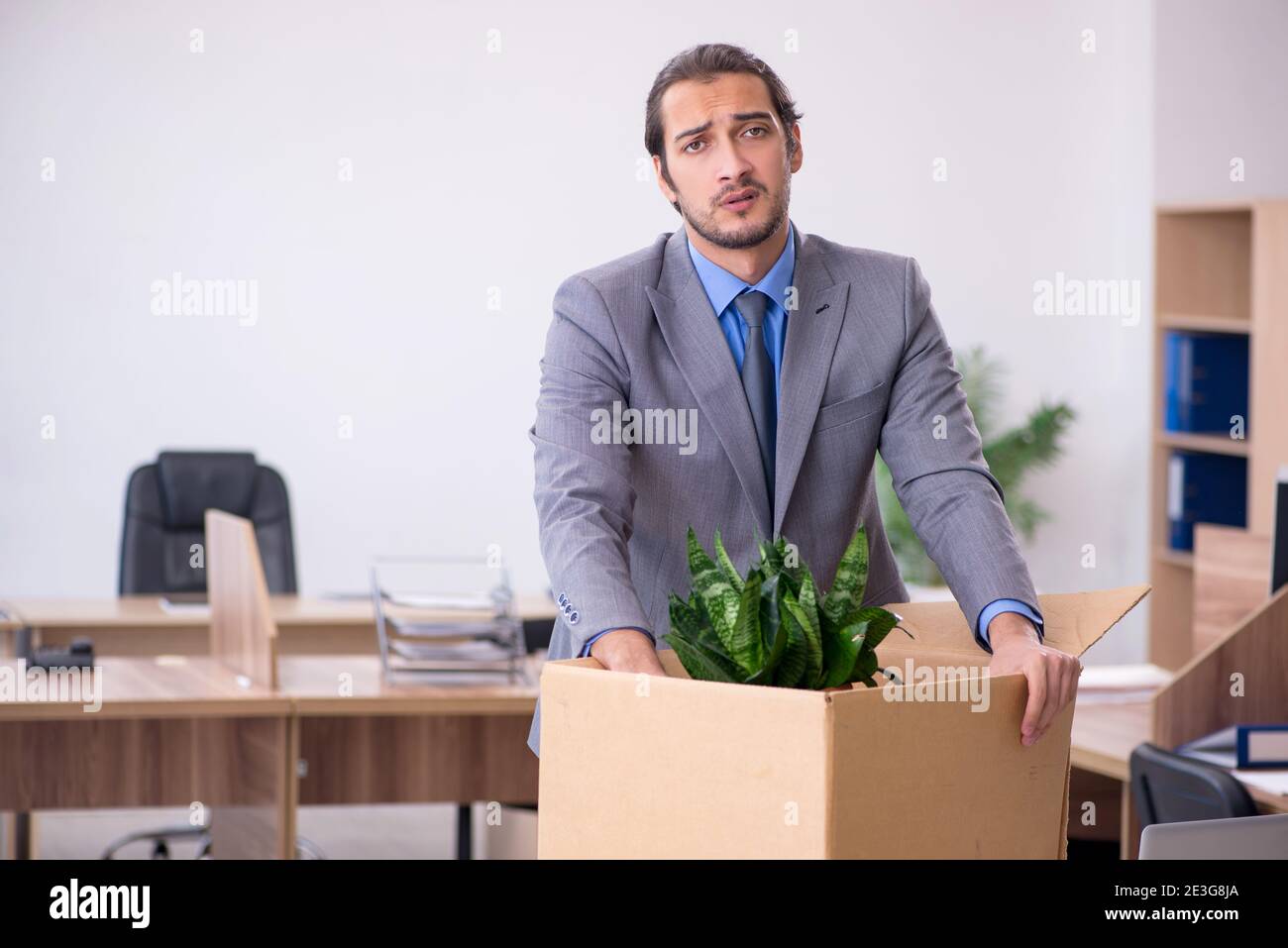 Young employee being fired from his work Stock Photo - Alamy