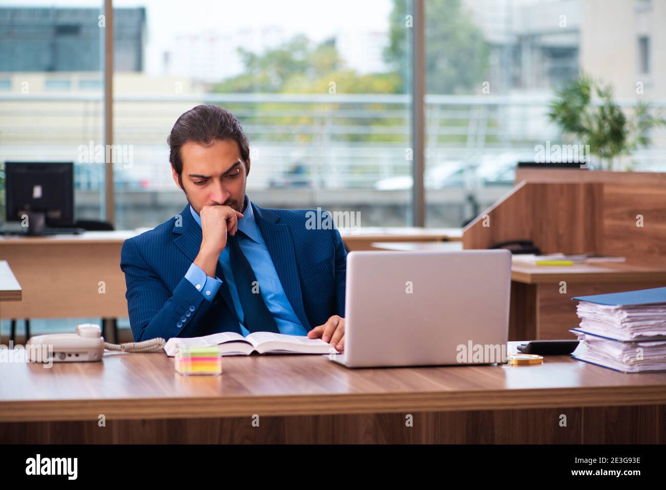 Young man handbook office hi-res stock photography and images - Alamy