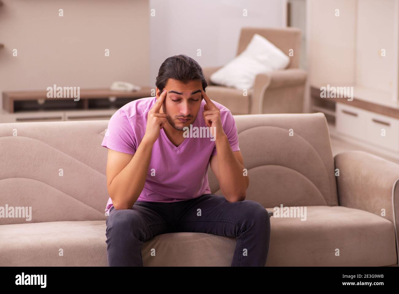 Man staying at home during pandemic Stock Photo - Alamy