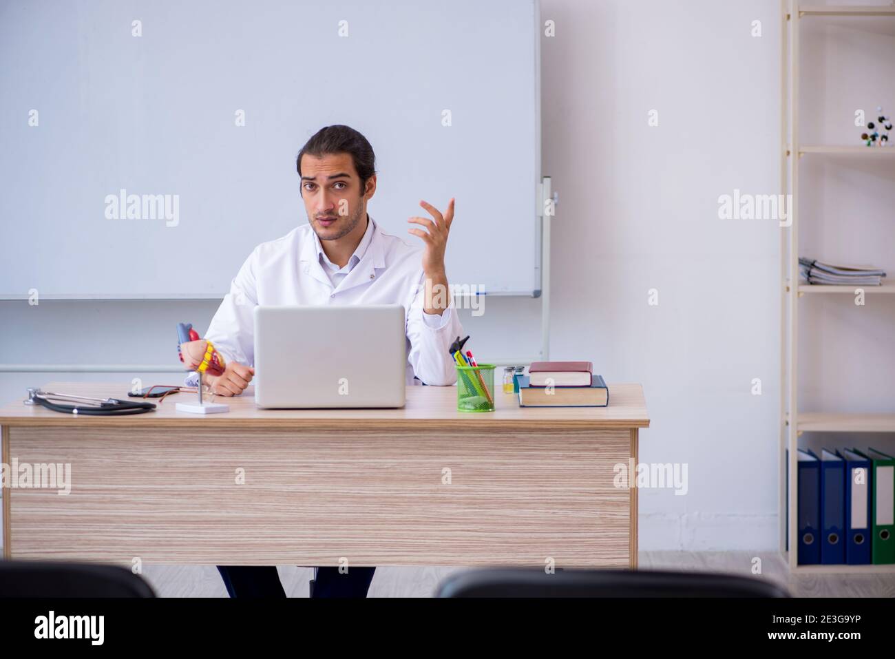 Young doctor giving seminar in the classroom Stock Photo - Alamy