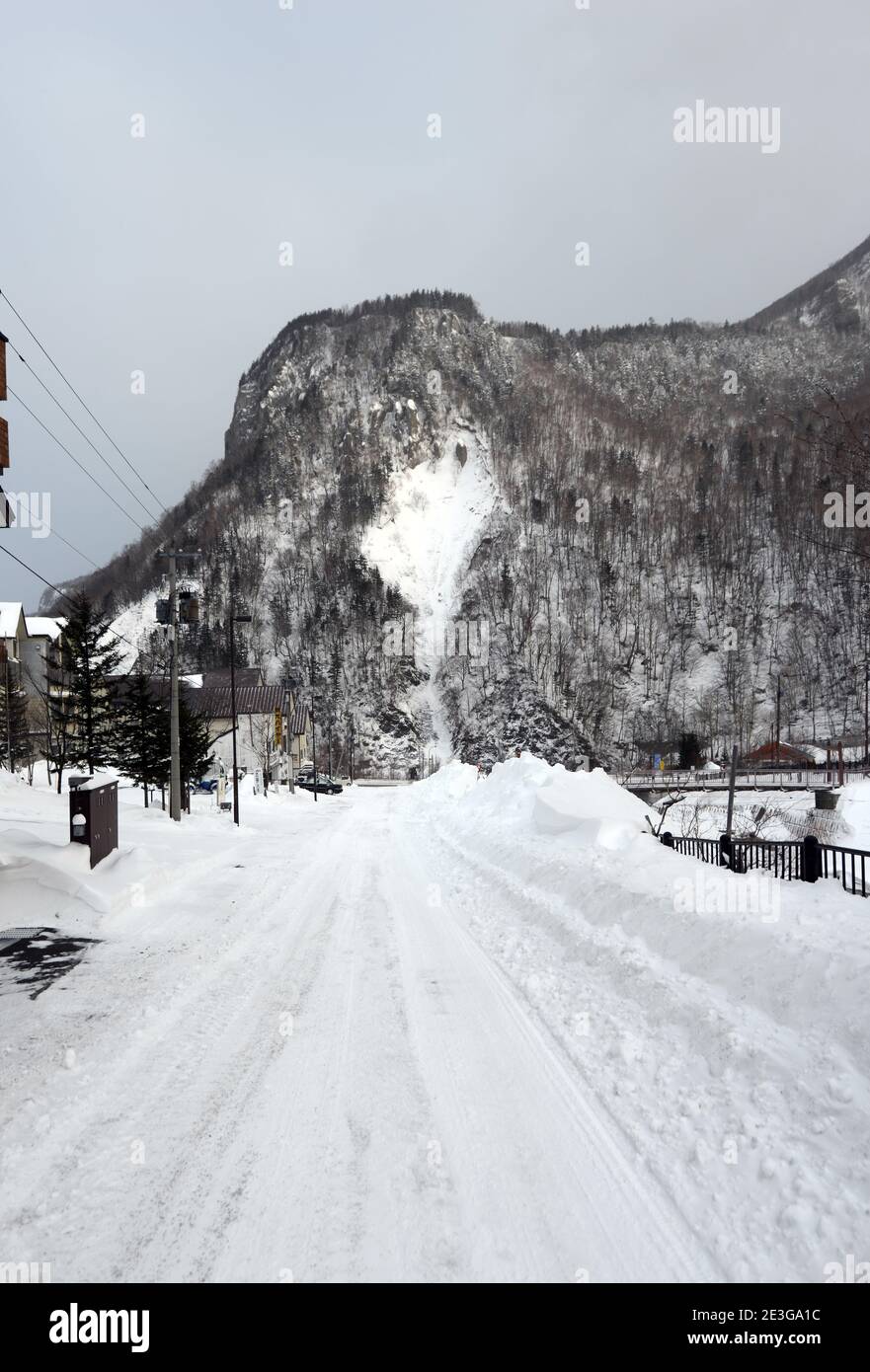 Driving on a road covered with snow in Sounkyo, Hokkaido, Japan Stock ...