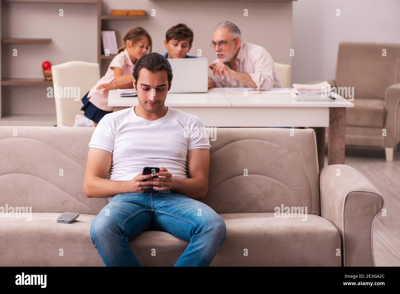 Three generations at home in early development concept Stock Photo - Alamy
