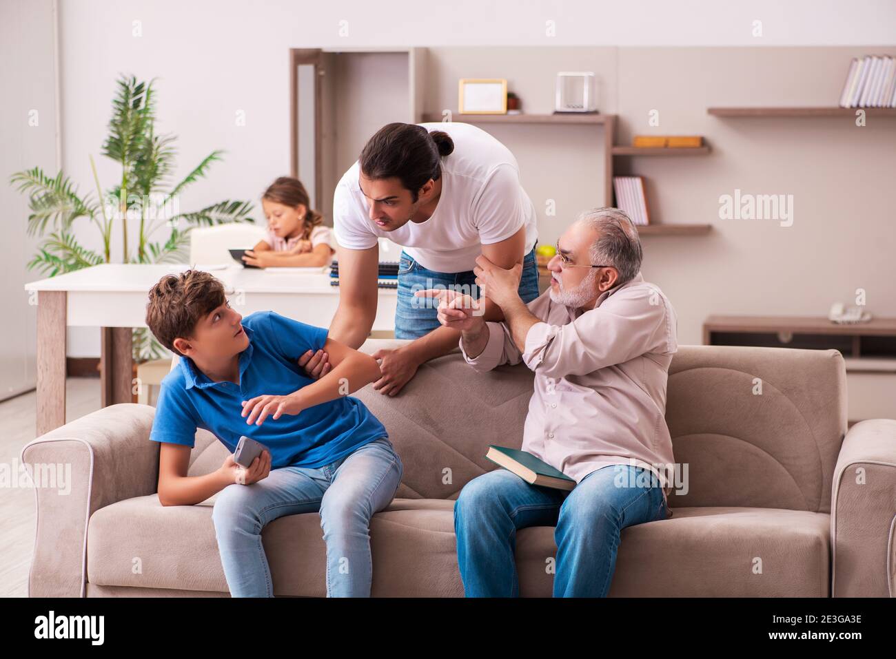 Three generations at home in early development concept Stock Photo - Alamy