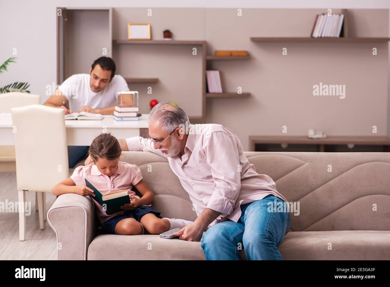 Three generations at home in early development concept Stock Photo - Alamy