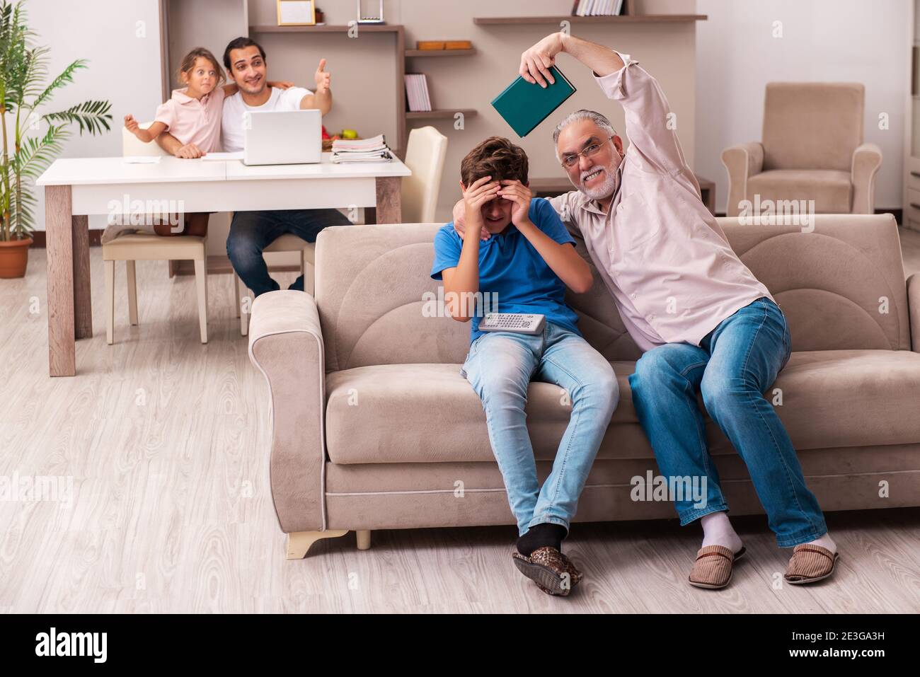 Three generations at home in early development concept Stock Photo - Alamy