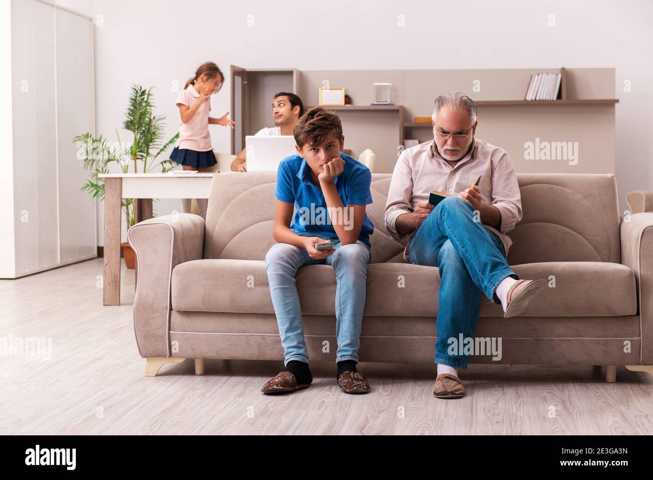 Three generations at home in early development concept Stock Photo - Alamy