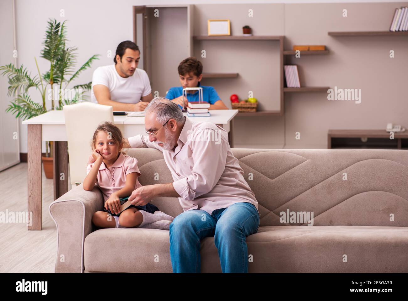 Three generations at home in early development concept Stock Photo - Alamy