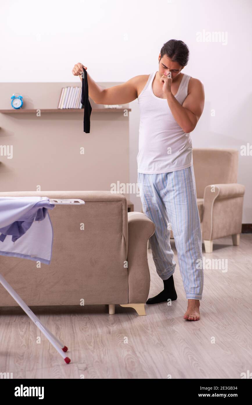 Young employee getting up late at home Stock Photo - Alamy