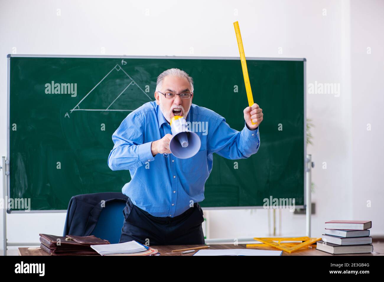 Angry teacher and ruler hi-res stock photography and images - Alamy