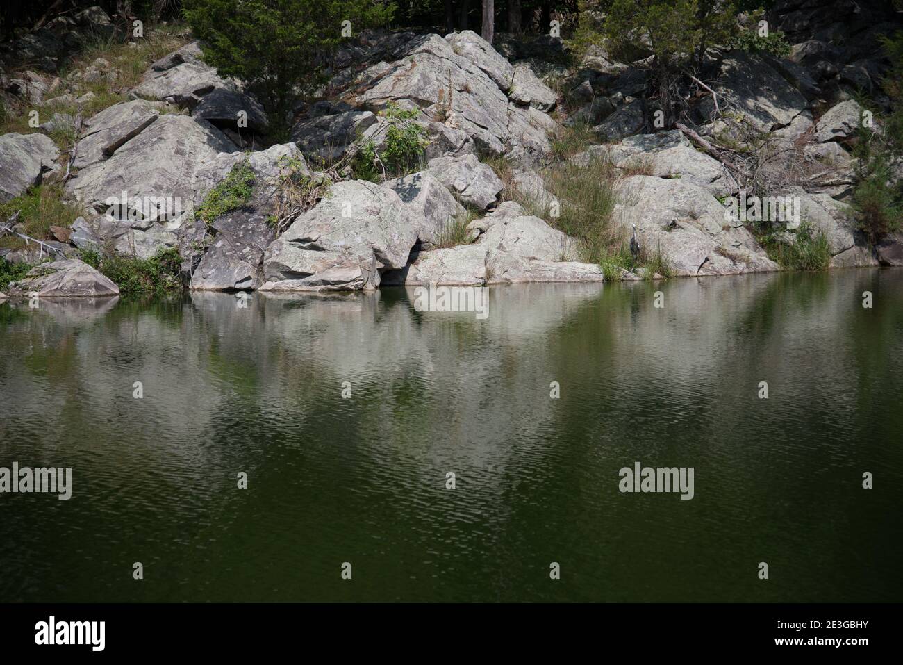 Rock formation along water stream Stock Photo - Alamy