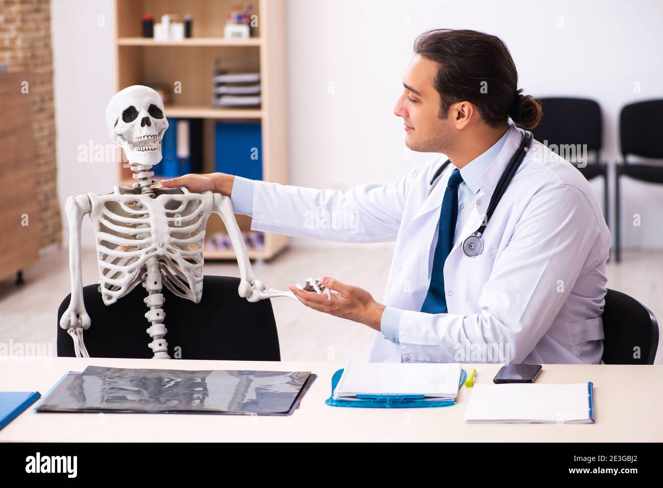Young doctor and skeleton patient in the clinic Stock Photo - Alamy