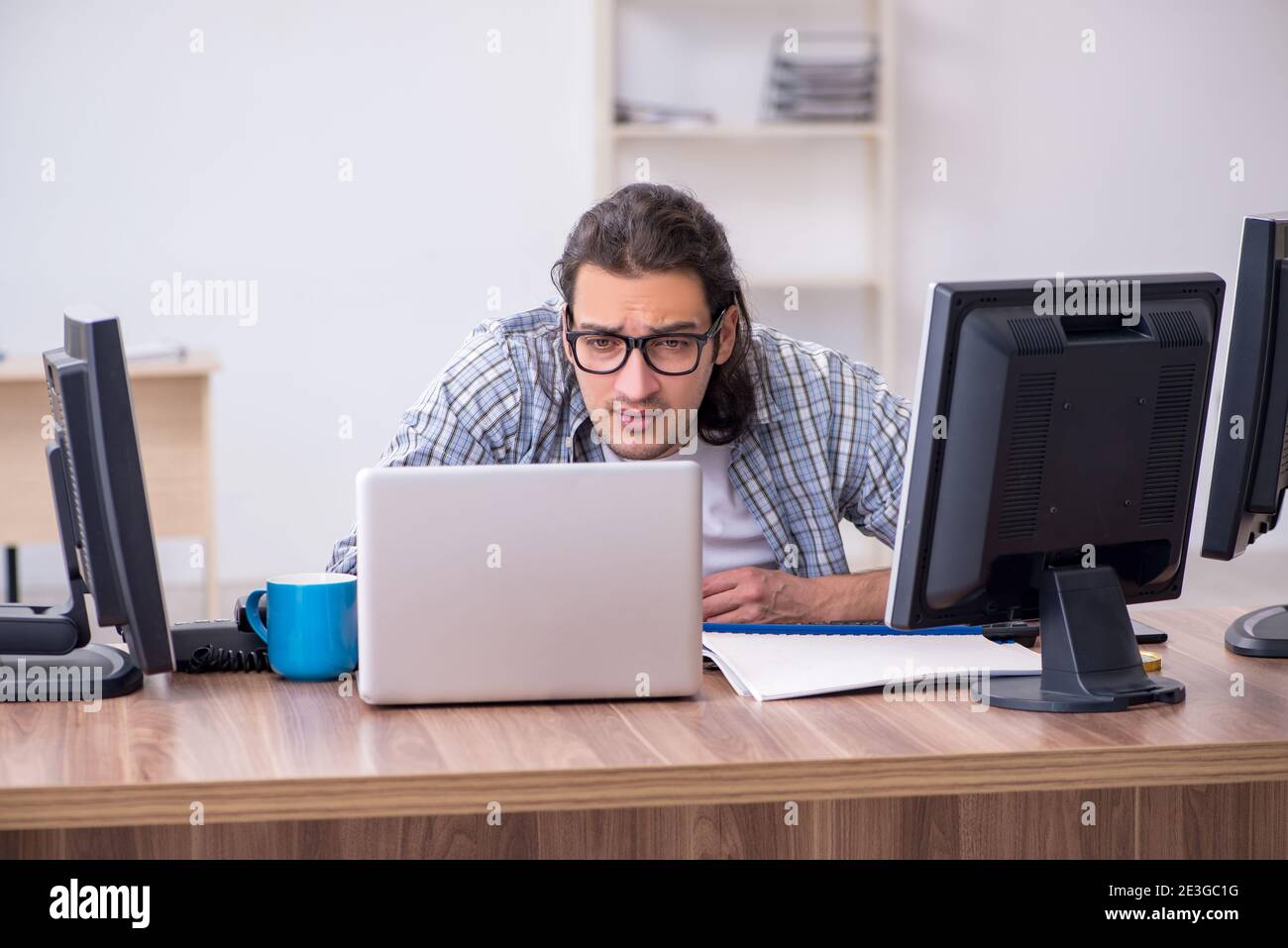 Male it specialist working in the office Stock Photo - Alamy