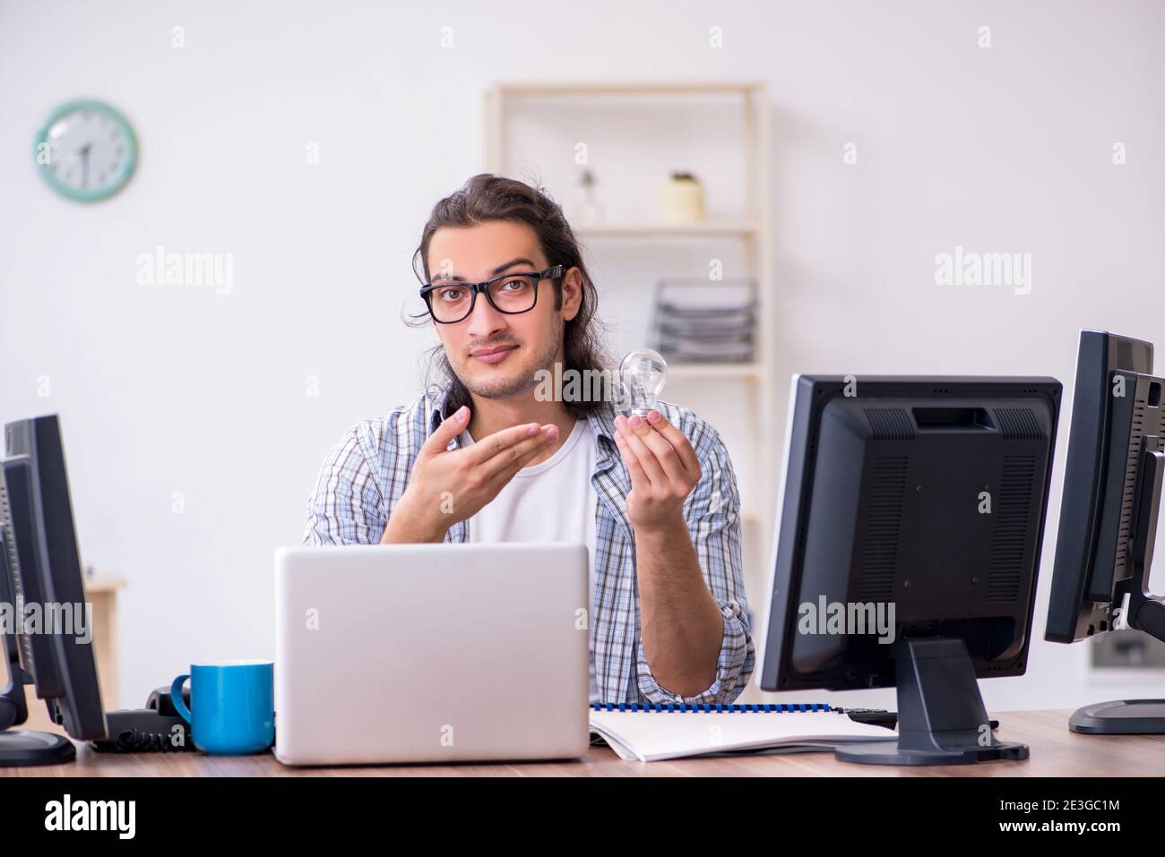 Male it specialist working in the office Stock Photo - Alamy