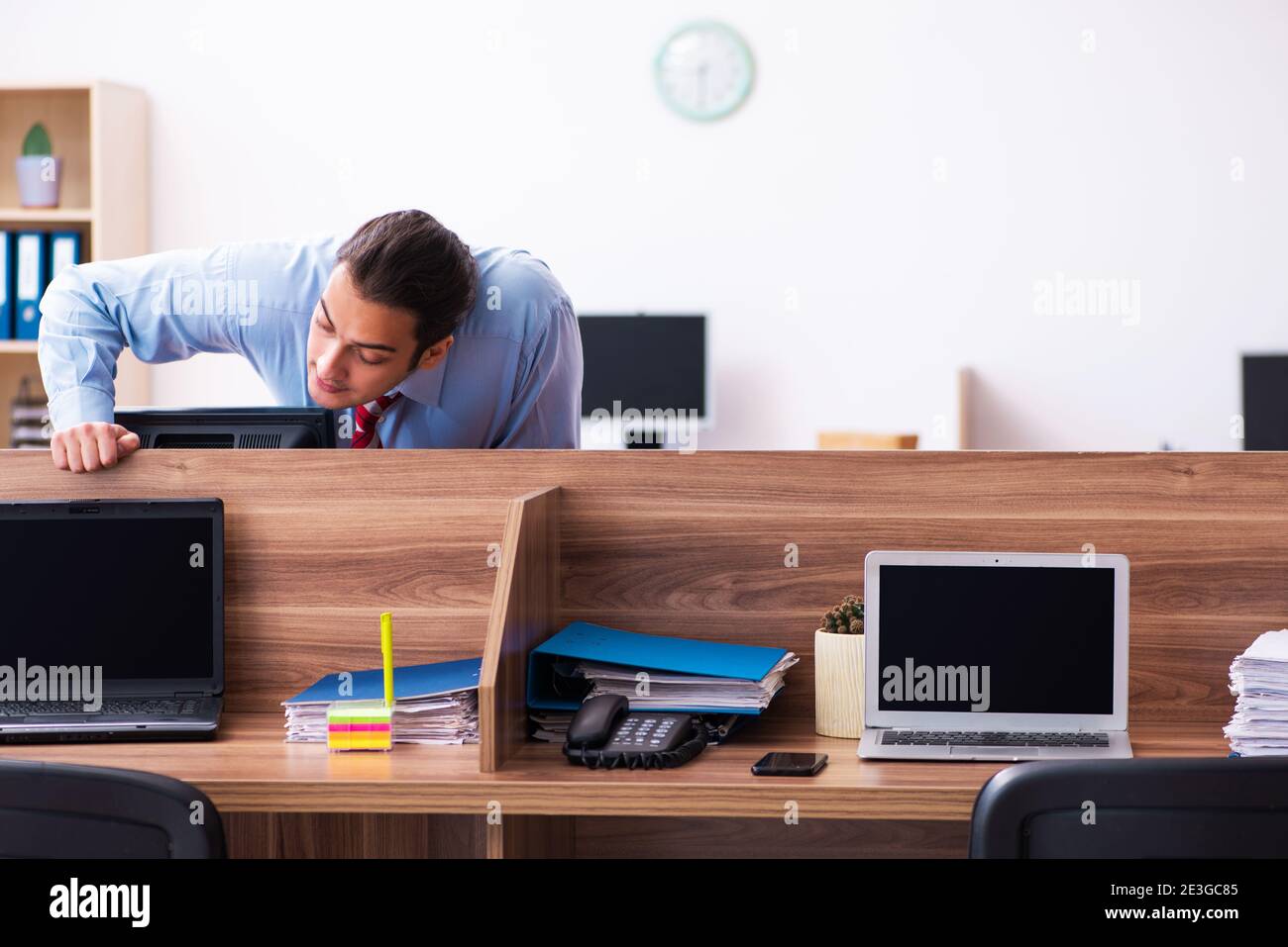 Male employee in industrial espionage concept Stock Photo - Alamy